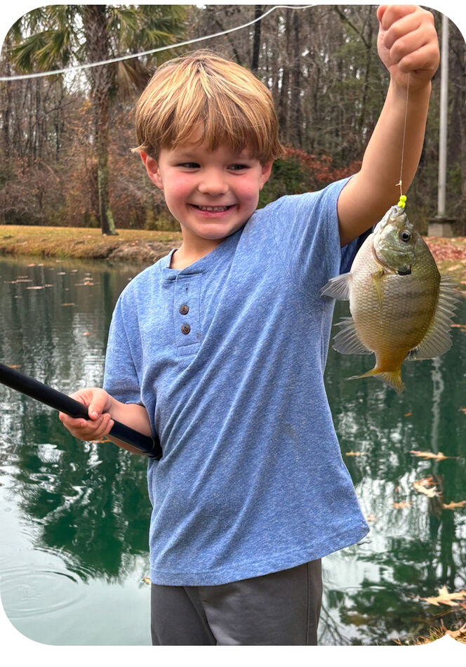 Grandson with a great catch: Farm pond fishing!